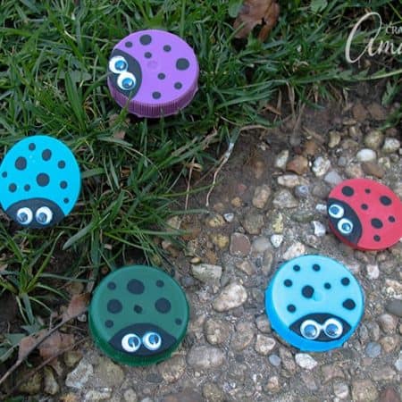 Plastic Lid Ladybugs: a cute kid's craft made from recycled milk lids!